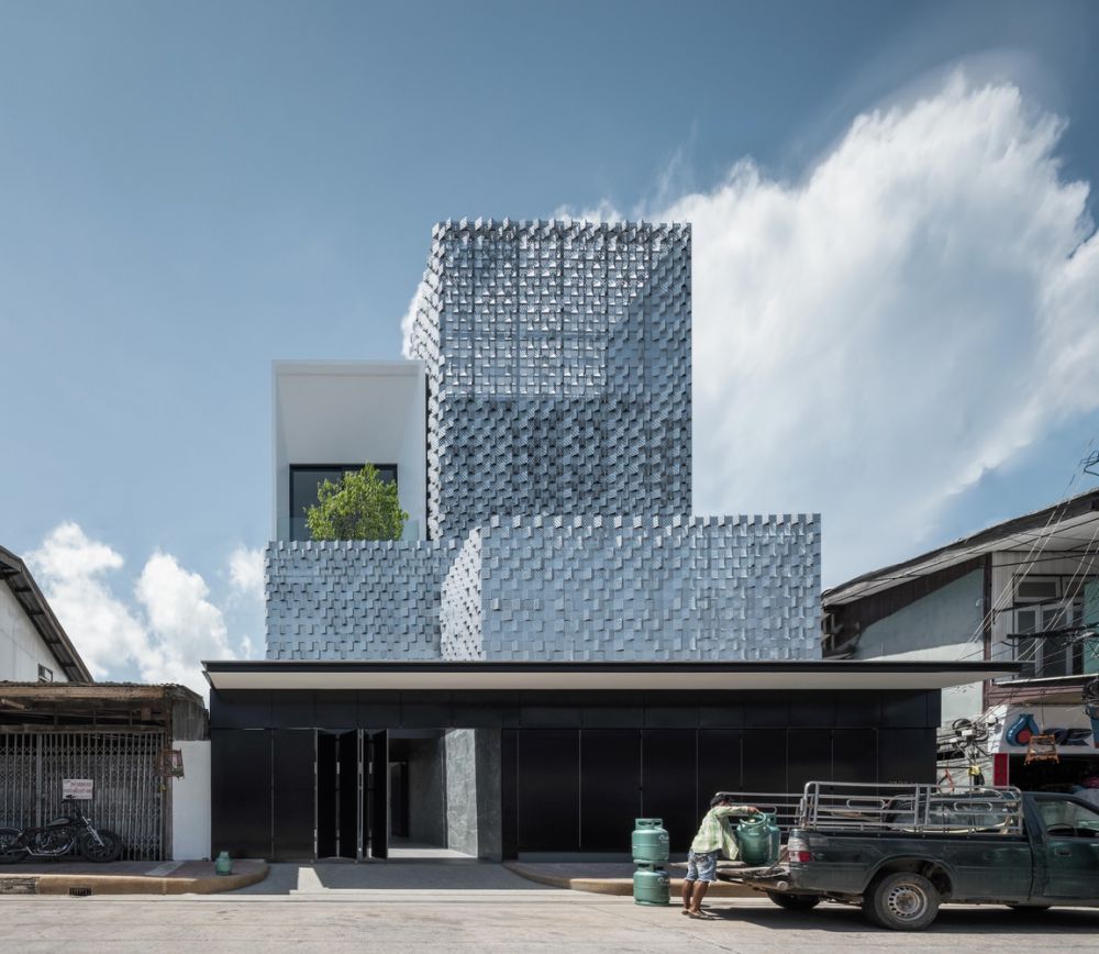 salient house highlights perforated geometry and an origami-inspired ...
