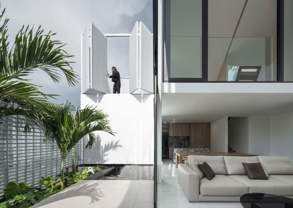 salient house highlights perforated geometry and an origami-inspired ...