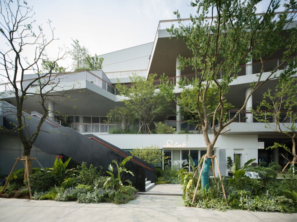 b.l.u.e architecture studio redefines community spaces through stacked ...