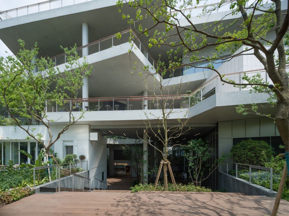 b.l.u.e architecture studio redefines community spaces through stacked ...