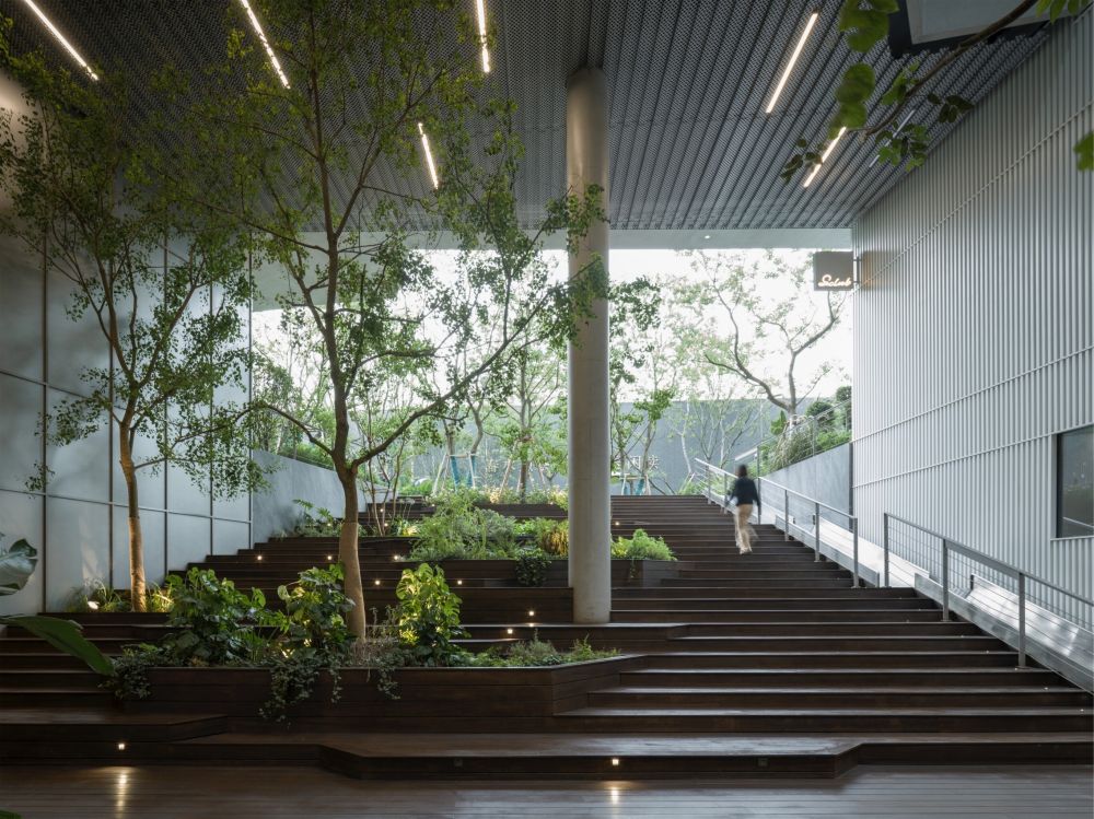 b.l.u.e architecture studio redefines community spaces through stacked ...