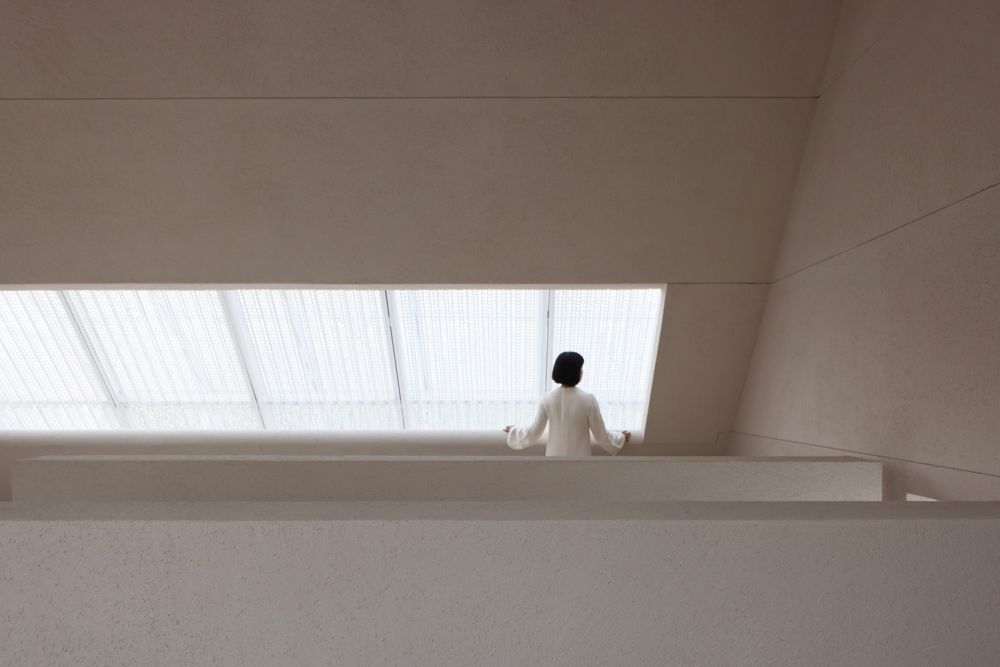 the breeze hall invites a moment of reflection through its feather ...