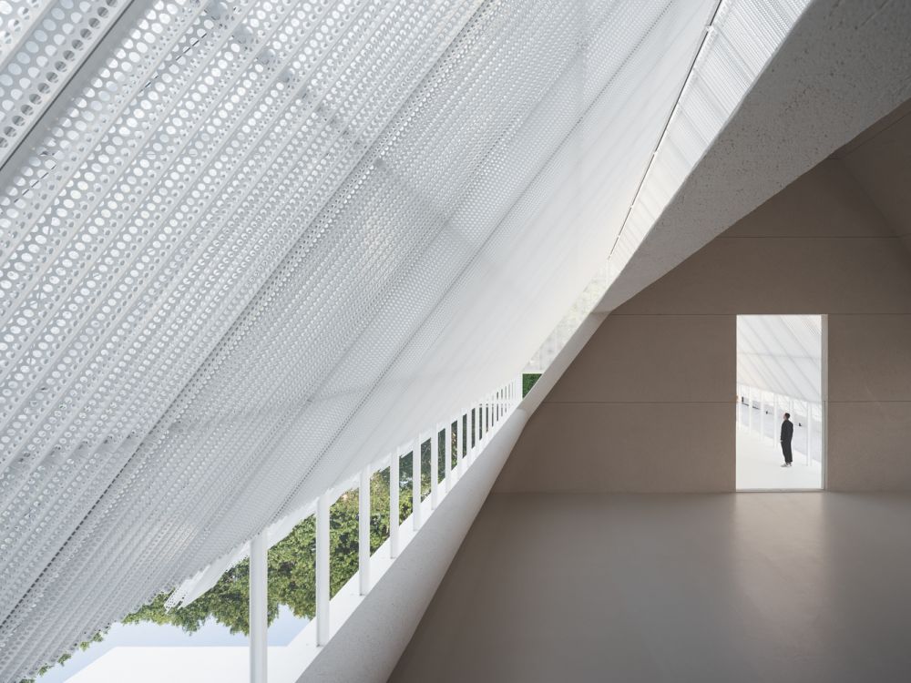 the breeze hall invites a moment of reflection through its feather ...