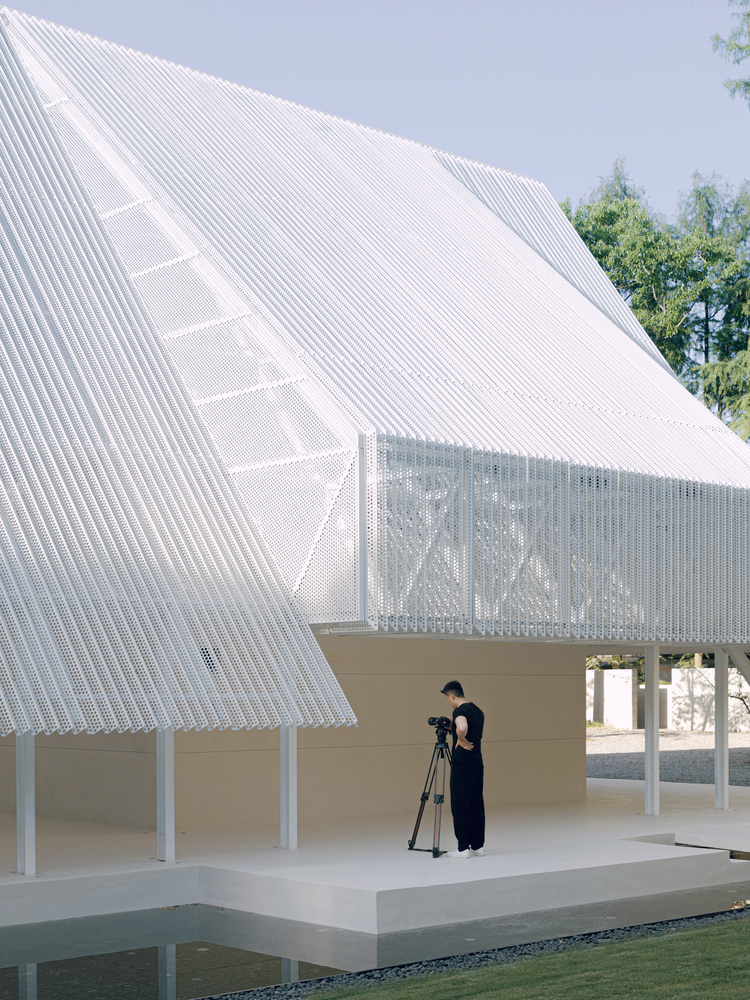 the breeze hall invites a moment of reflection through its feather ...