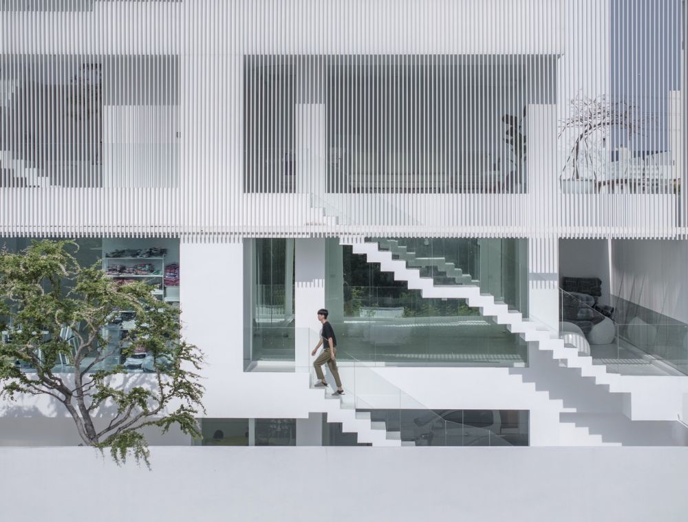 the contemporary canvas house paints a timeless harmony in white ...