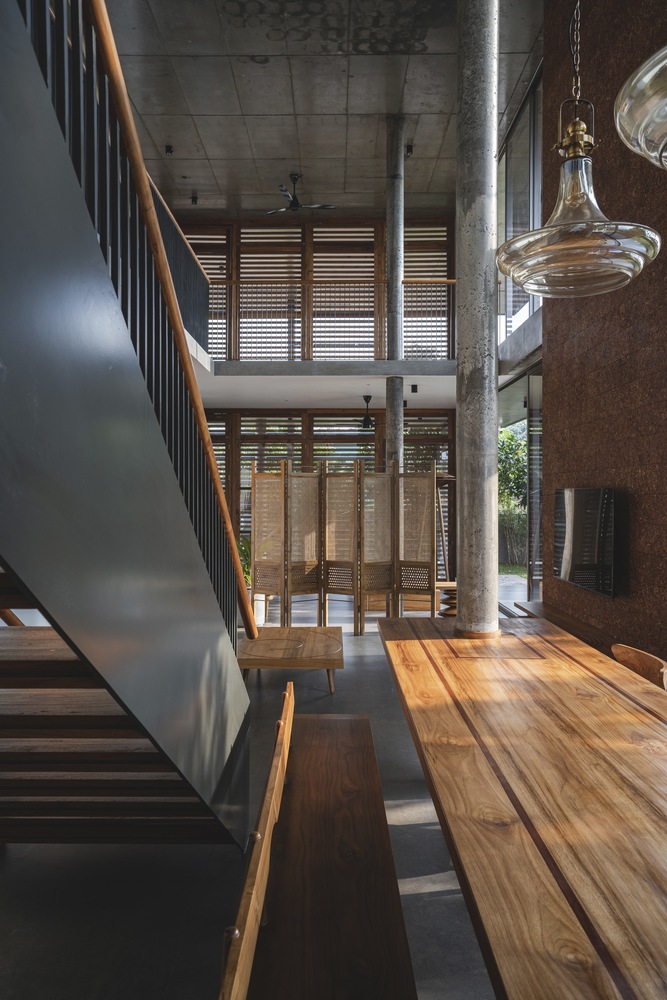 the slab house's open-air interiors and high ceilings generates ...