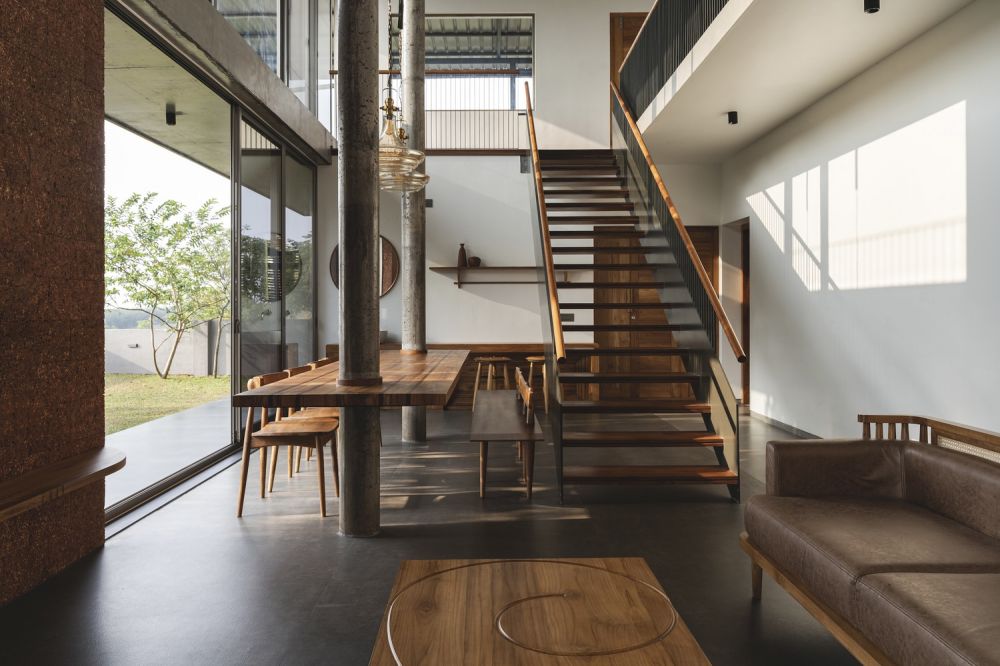the slab house's open-air interiors and high ceilings generates ...