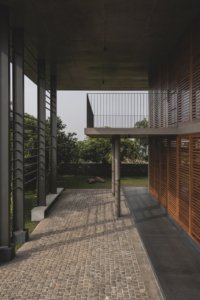 the slab house's open-air interiors and high ceilings generates ...