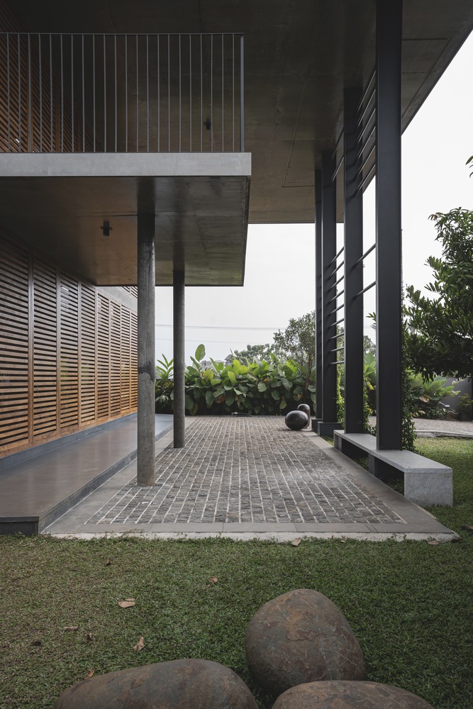 the slab house's open-air interiors and high ceilings generates ...