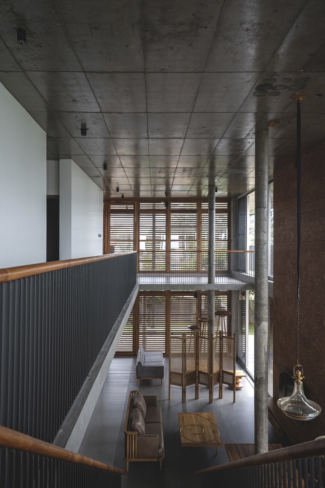 the slab house's open-air interiors and high ceilings generates ...