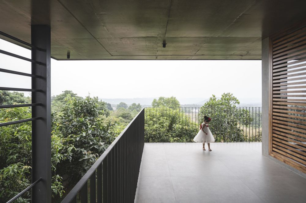 the slab house's open-air interiors and high ceilings generates ...