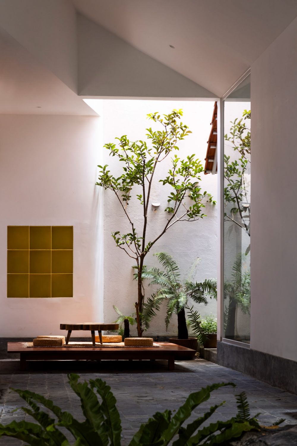 tile house exemplifies a harmonious unity of architecture and nature ...