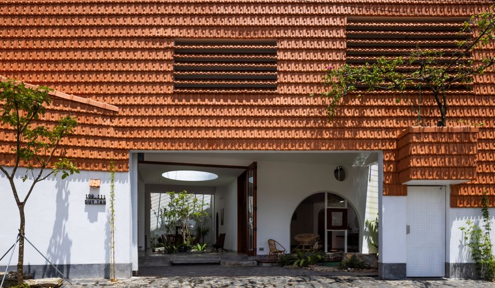 tile house exemplifies a harmonious unity of architecture and nature ...