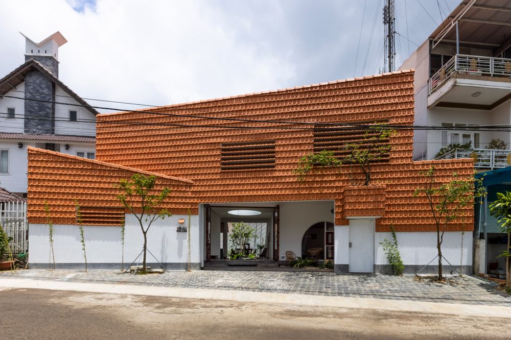 tile house exemplifies a harmonious unity of architecture and nature ...