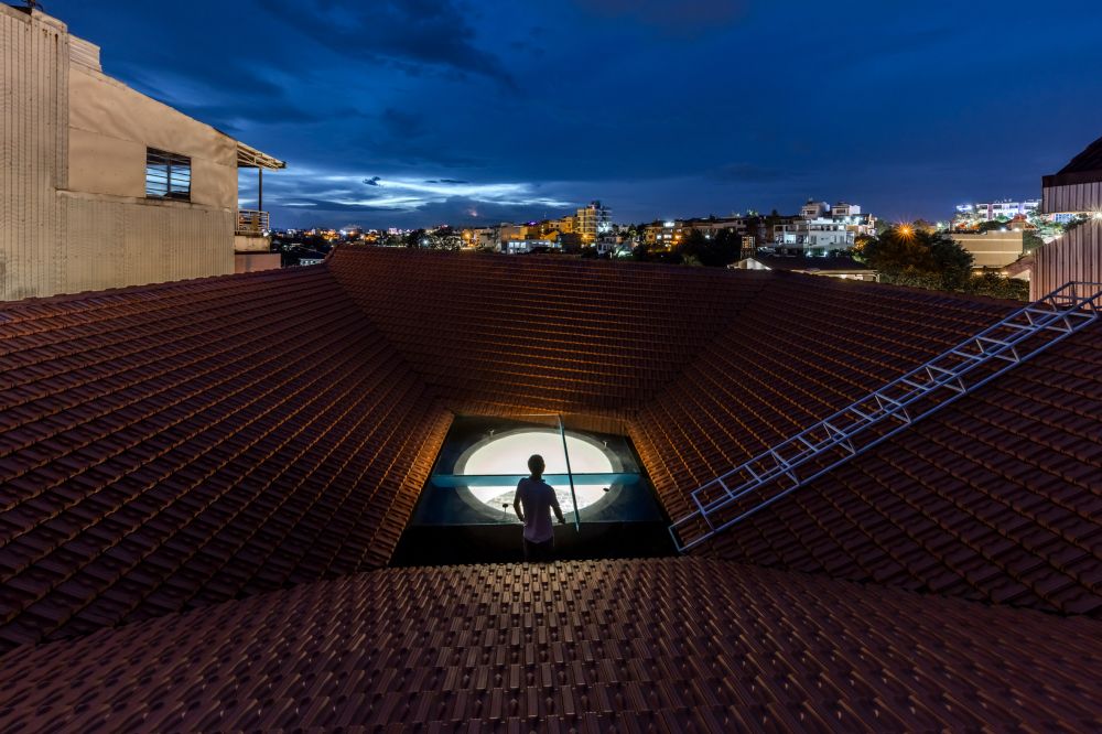 tile house exemplifies a harmonious unity of architecture and nature ...