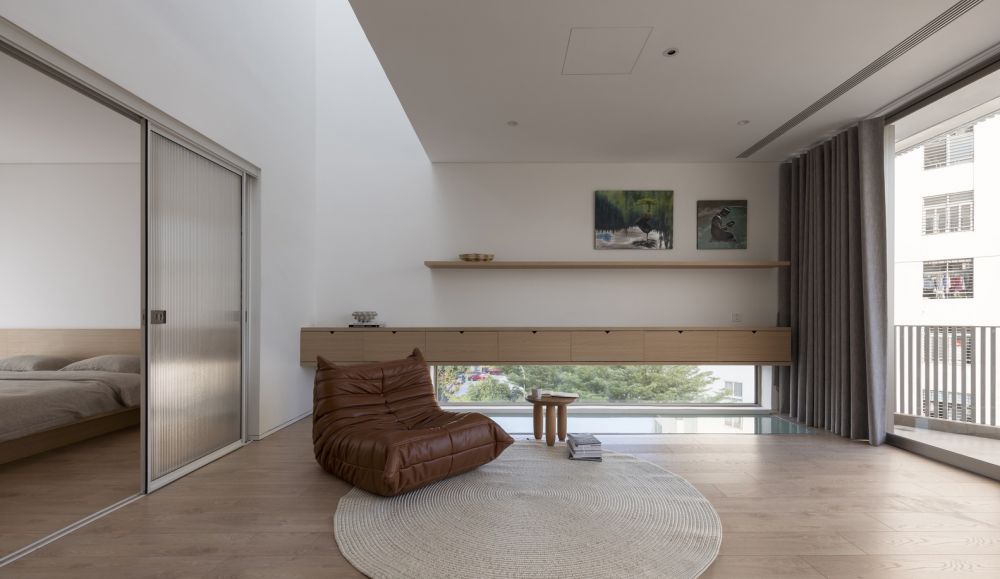 tram house redefines urban living in a white tower haven: project by ho ...