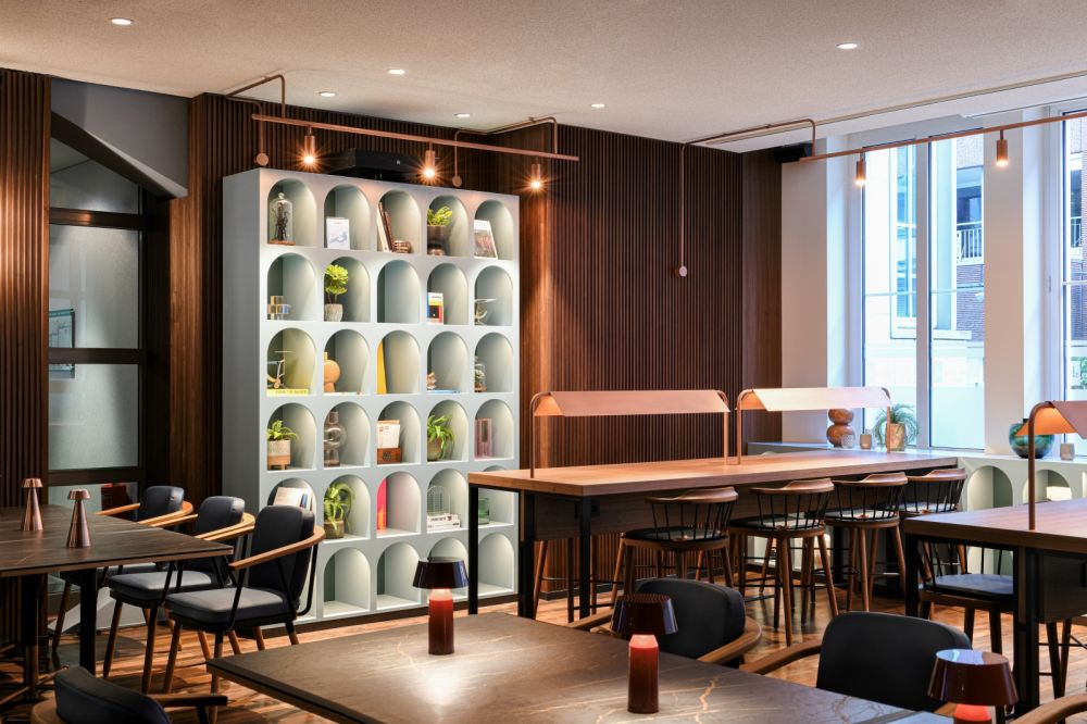 inside a retro-inspired pigeon post-bar & eatery at hilton cologne ...