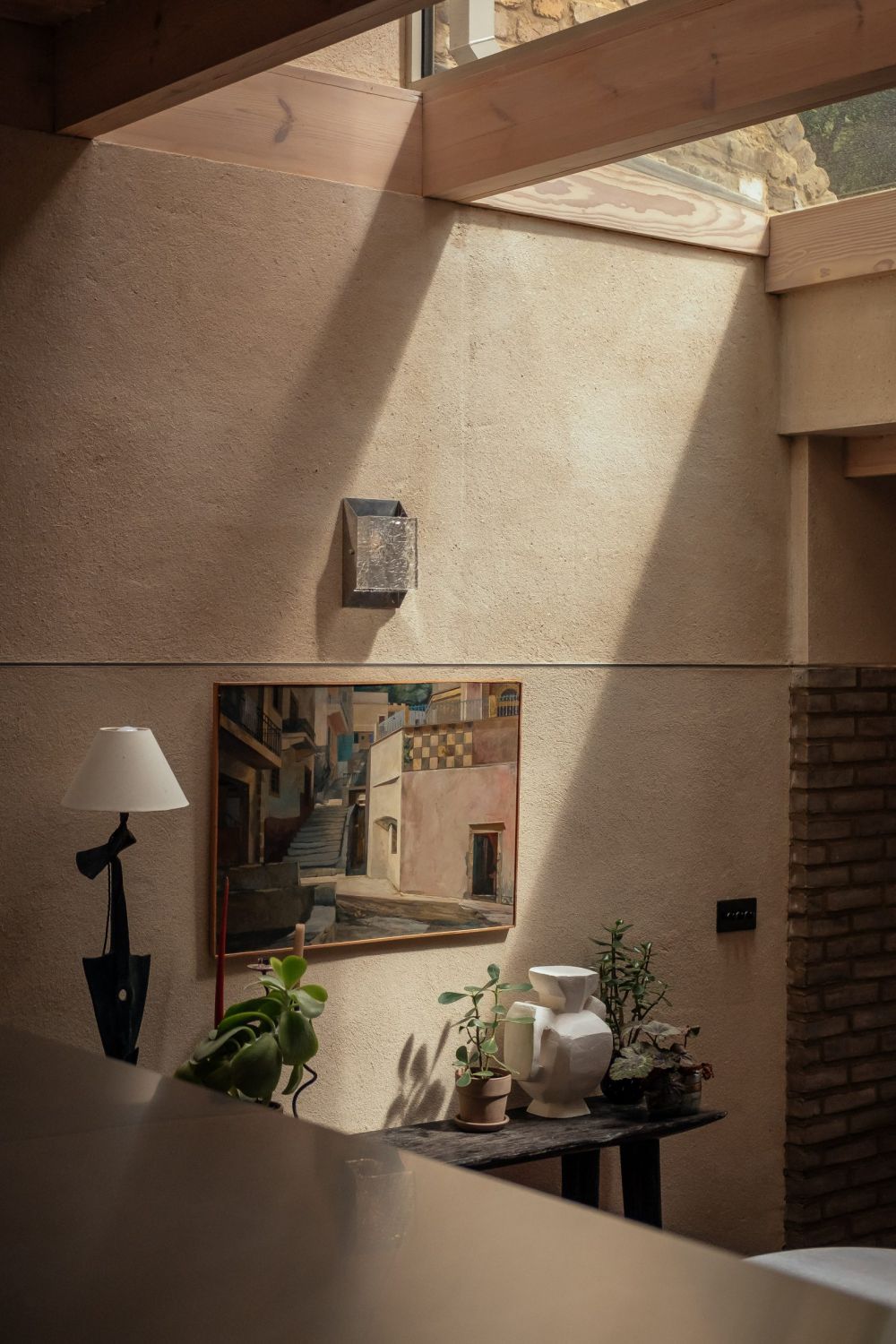 exposed brick walls and muted colors to accentuate serenity on walled ...